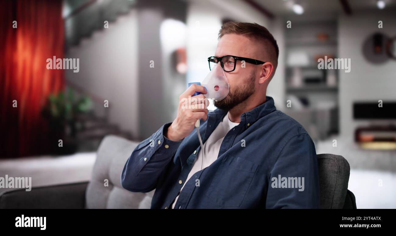 Young man using nebulizer hi-res stock photography and images - Alamy
