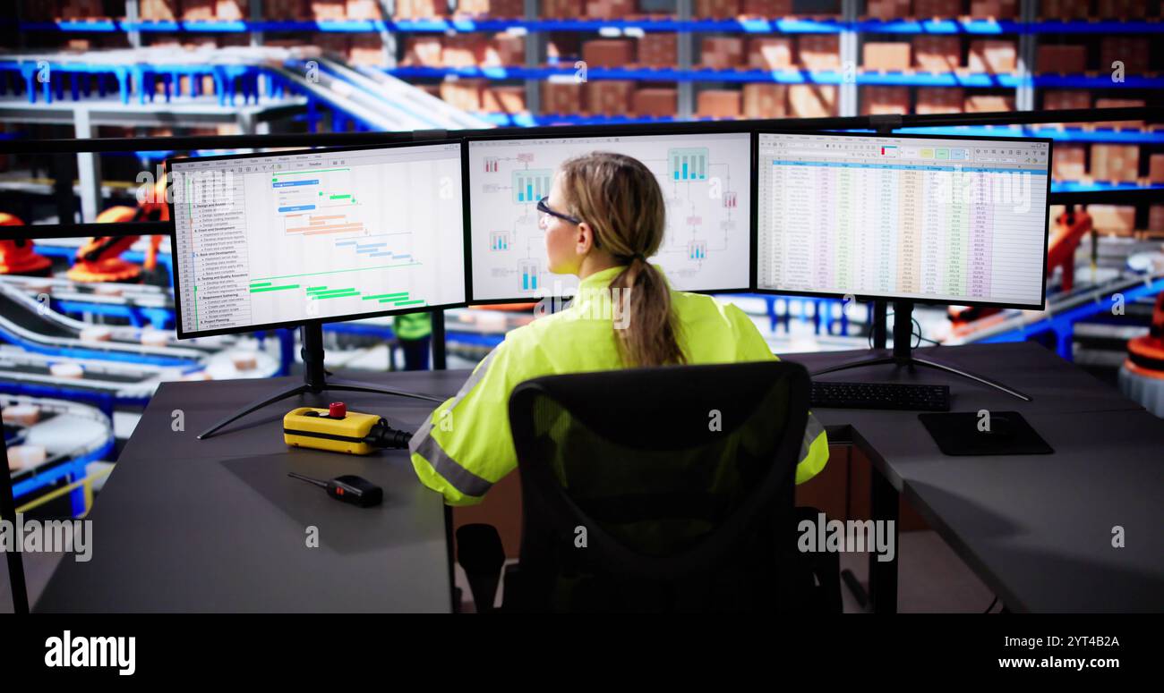 Logistics Warehouse Manager Using Desktop Computer With Multiple ...