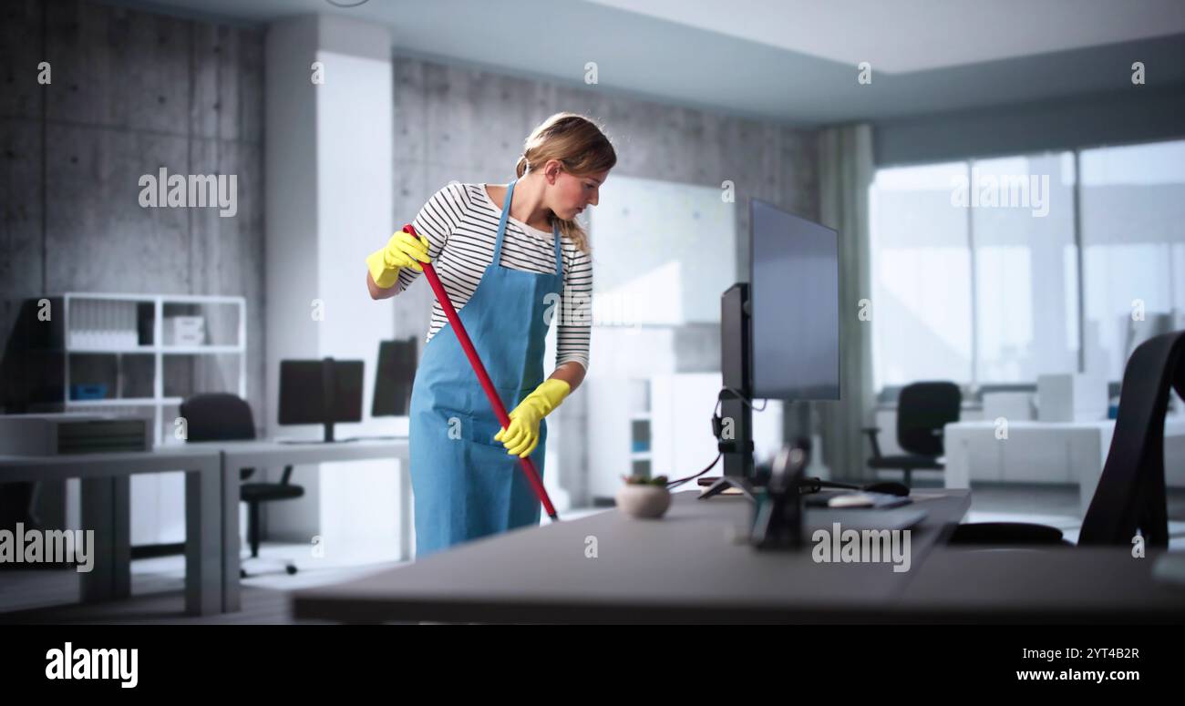 Female Janitor With Mop Cleaning Modern Office Floor Stock Photo - Alamy