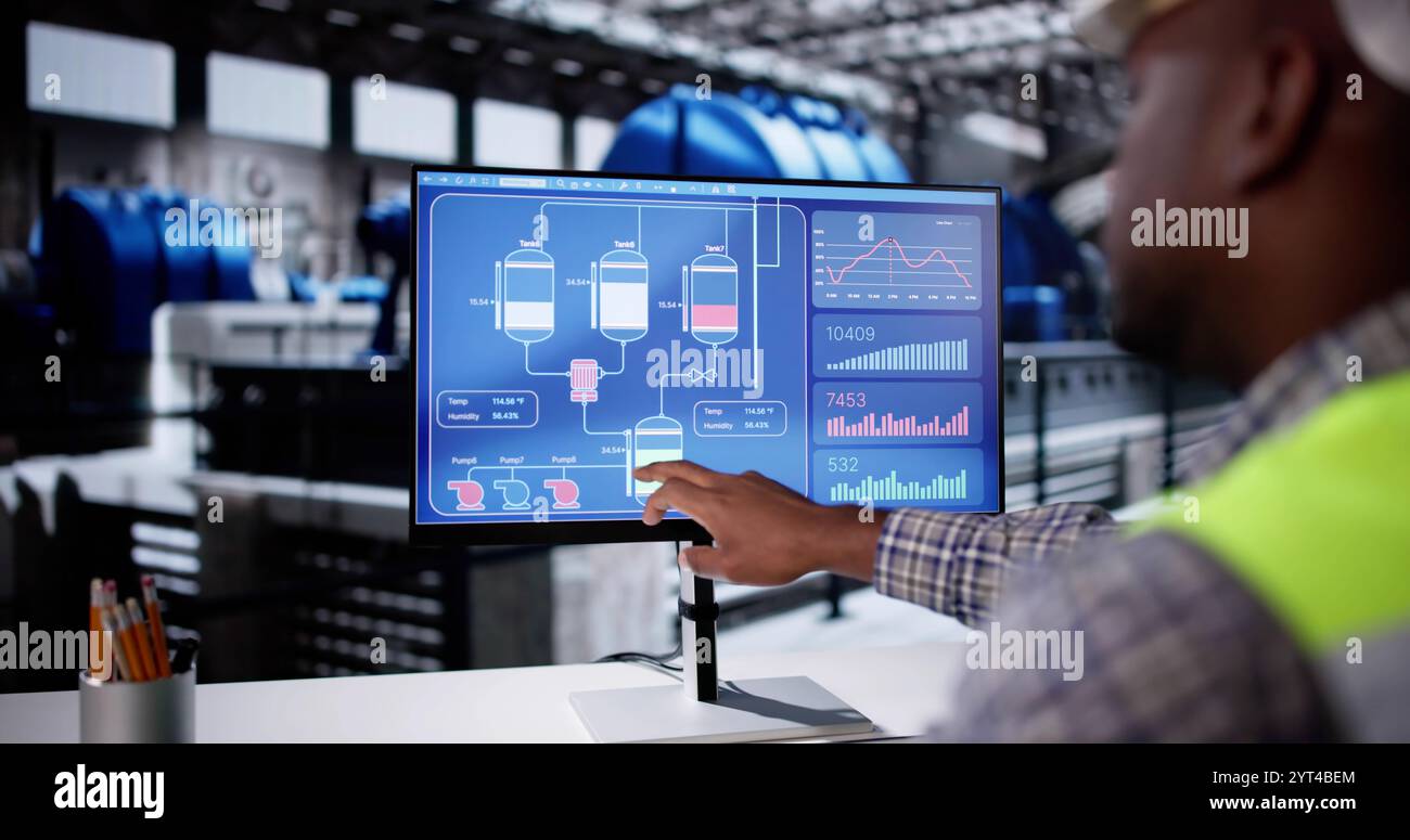 Power Plant Worker Using Scada Control System Stock Photo - Alamy