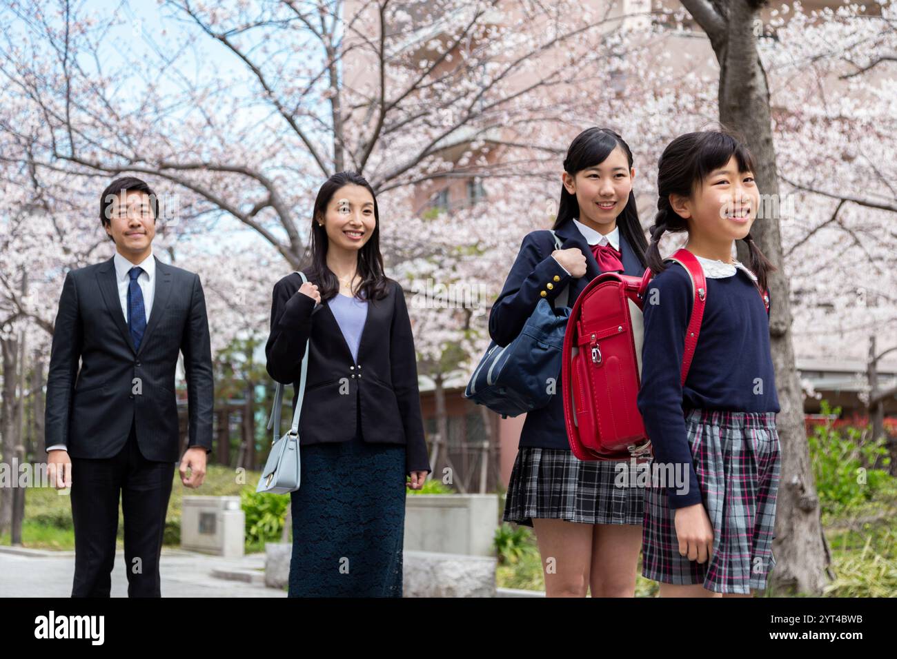 Children standing under a tree hi-res stock photography and images - Alamy