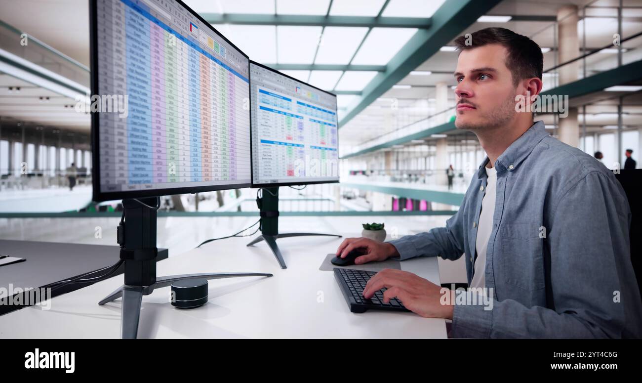Data Analyst Man Using Spreadsheet On Computer Stock Photo - Alamy