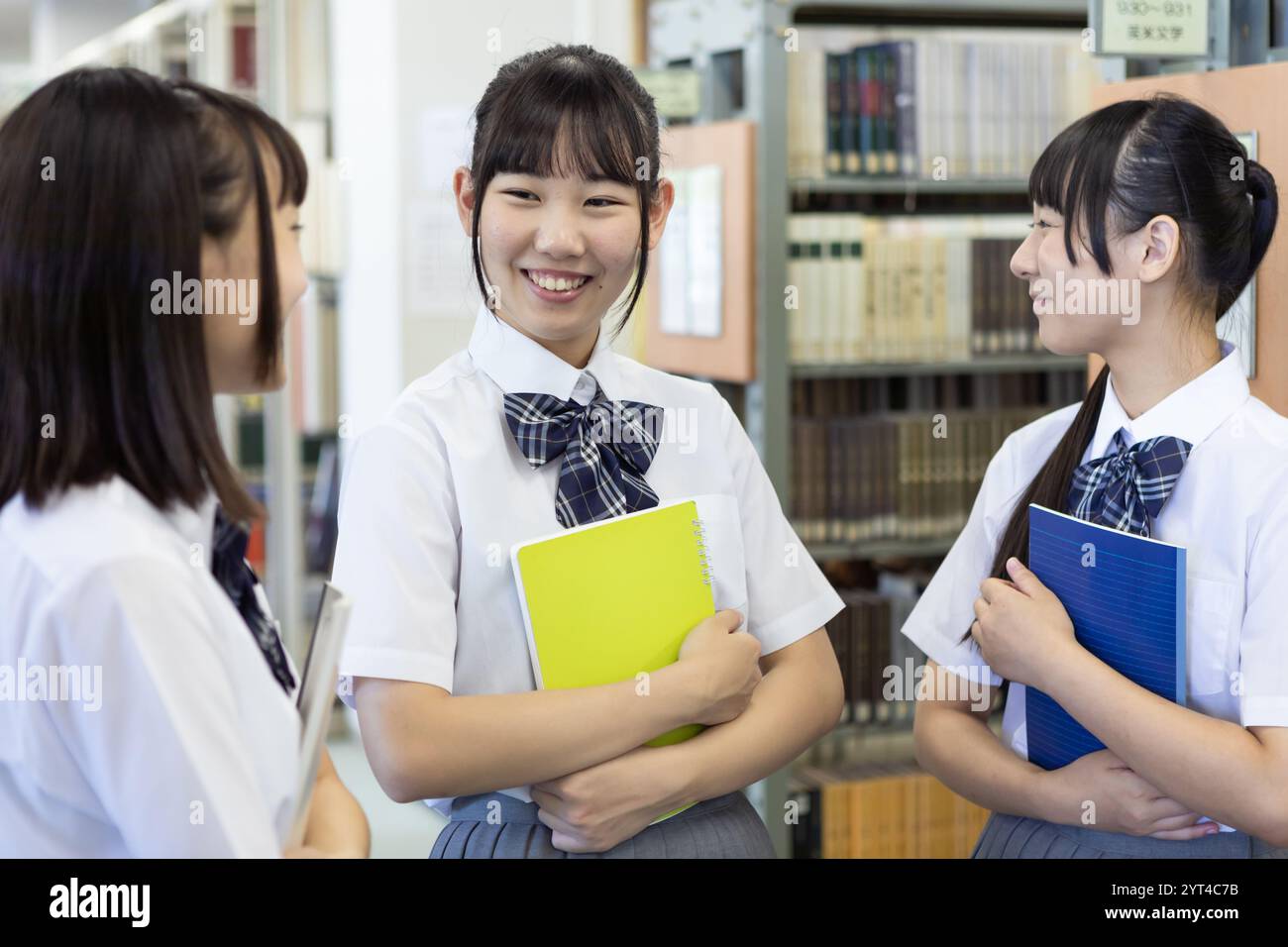 High school girls in the library Stock Photo - Alamy