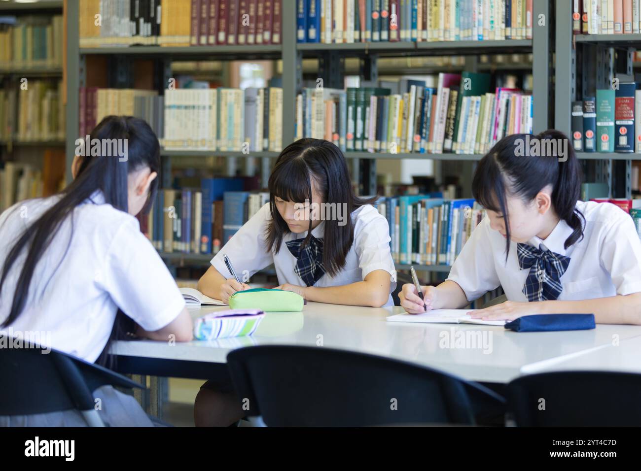High school girls studying in the library Stock Photo - Alamy