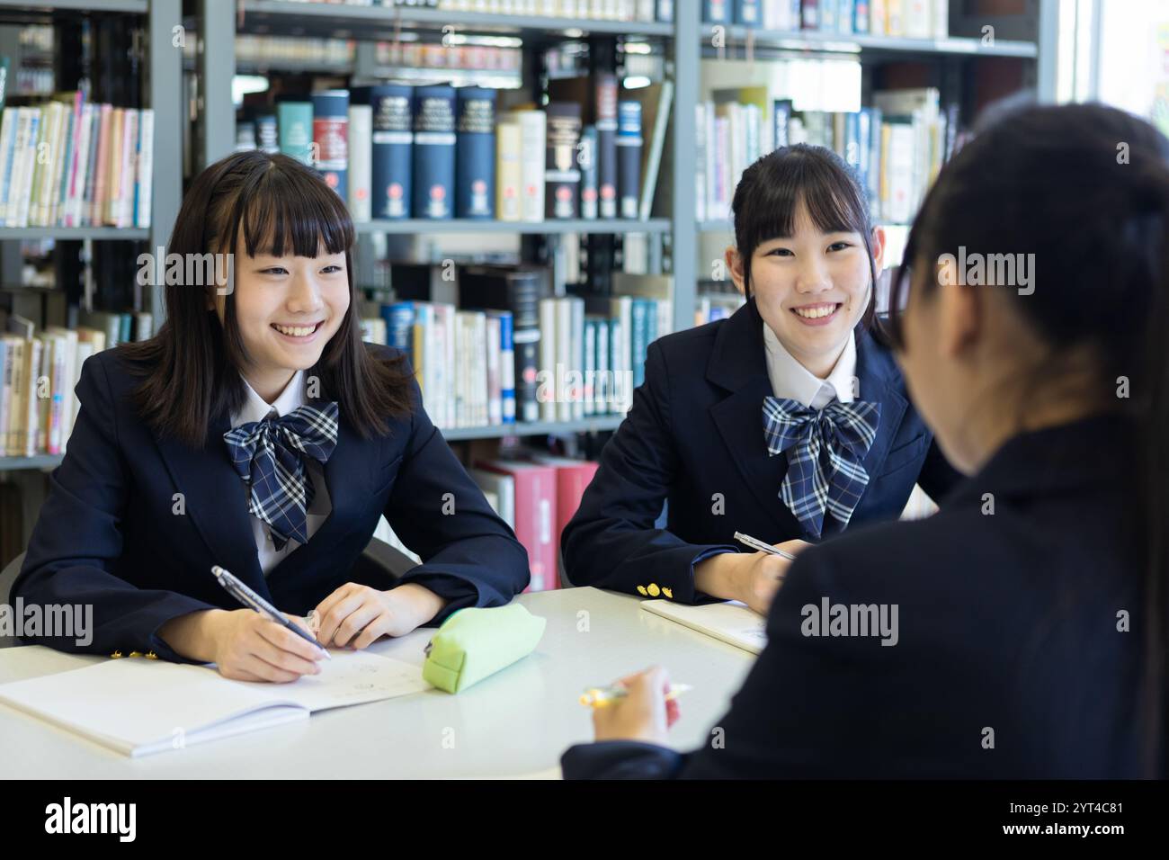 High school girls studying in the library Stock Photo - Alamy