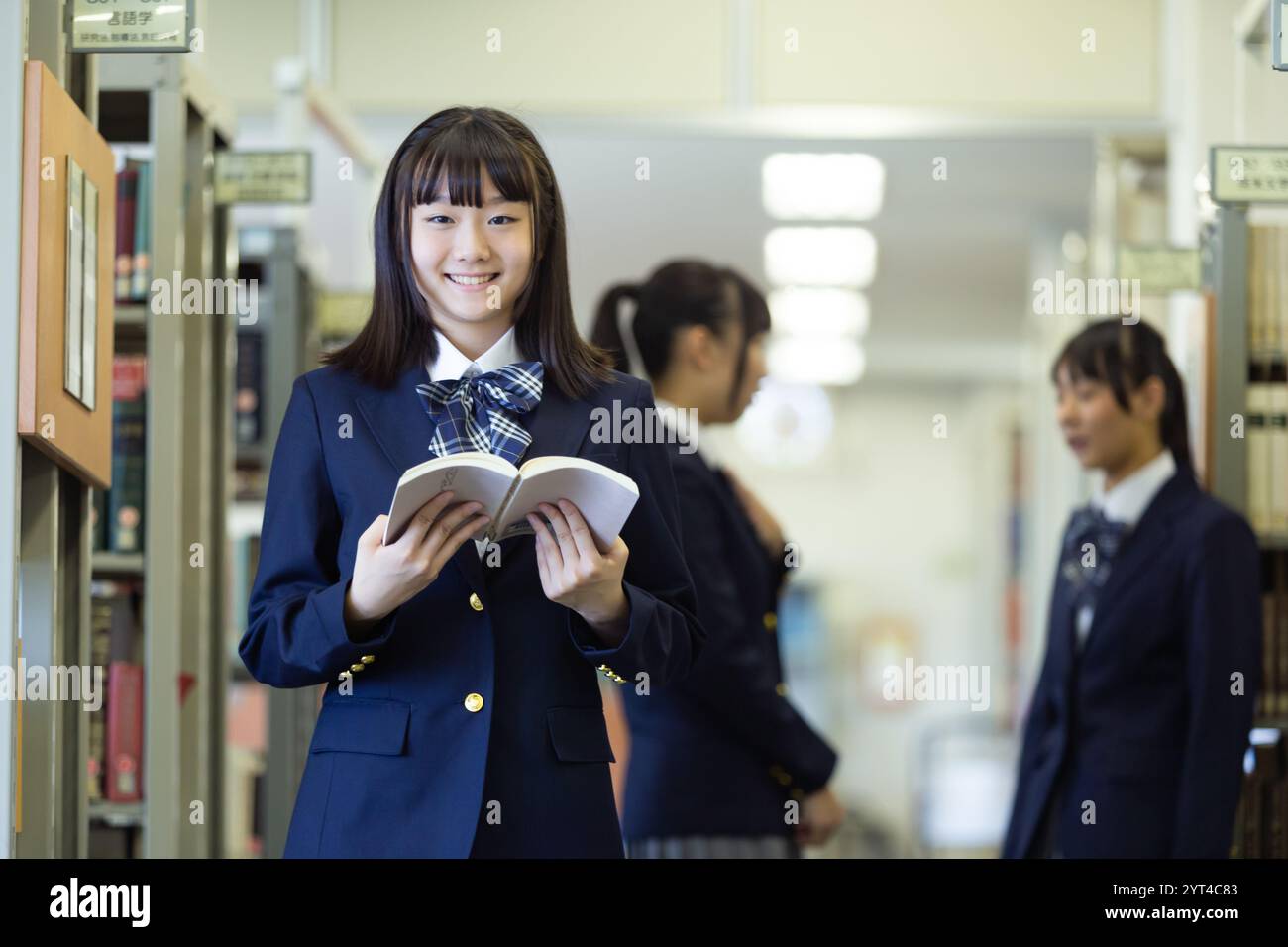 High school girls in the library Stock Photo - Alamy