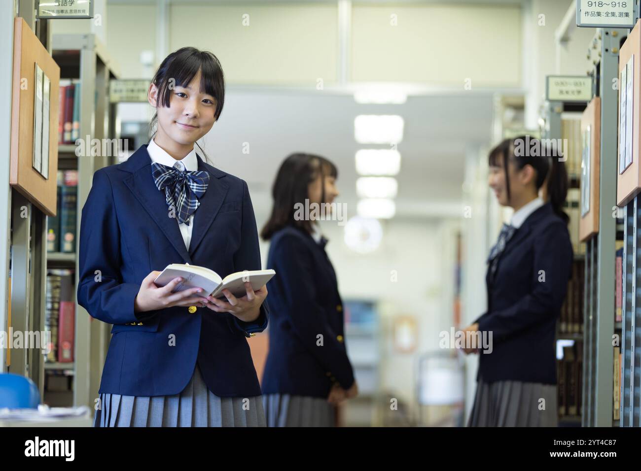 High school girls in the library Stock Photo - Alamy