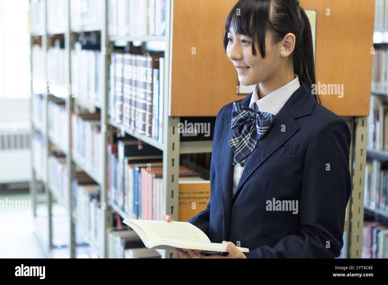 High school girls in the library Stock Photo - Alamy