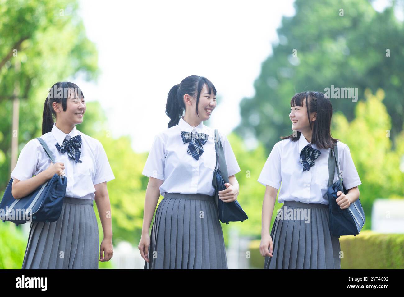 High school girls walking while conversing Stock Photo - Alamy