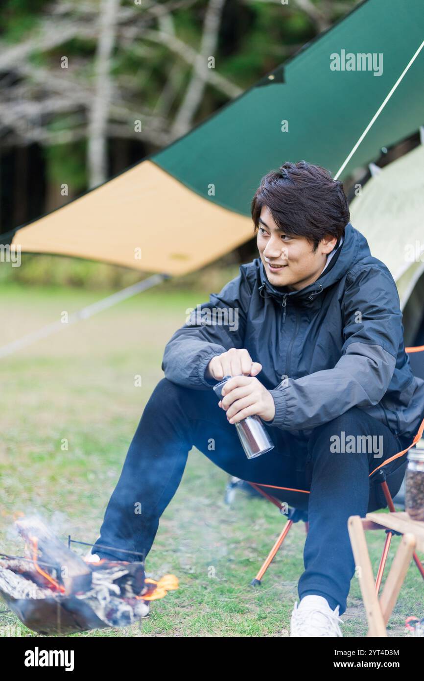 Man grinding coffee beans Stock Photo - Alamy