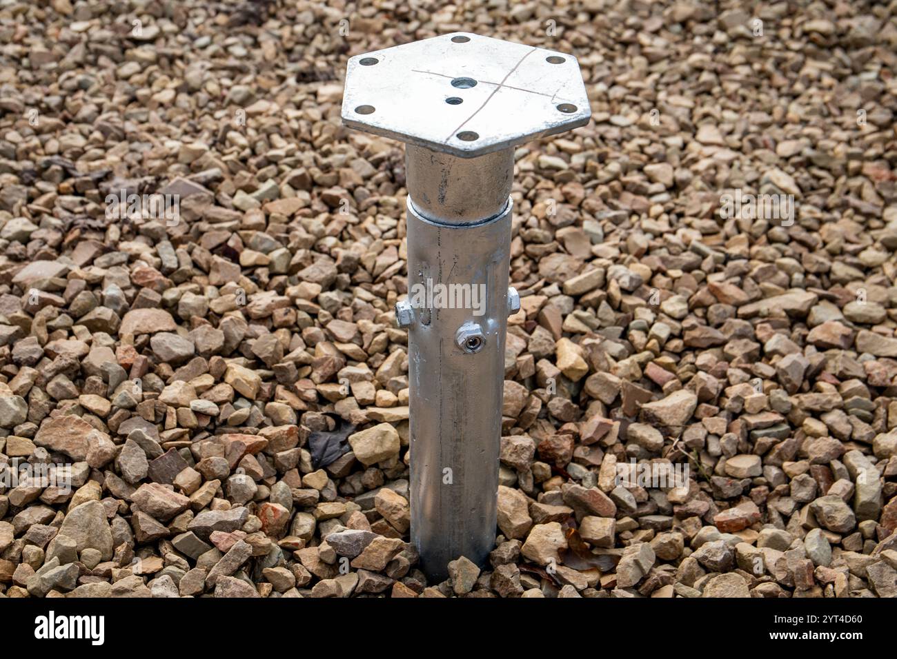 Galvanized screw piles screwed into the ground. Rubble at the ...