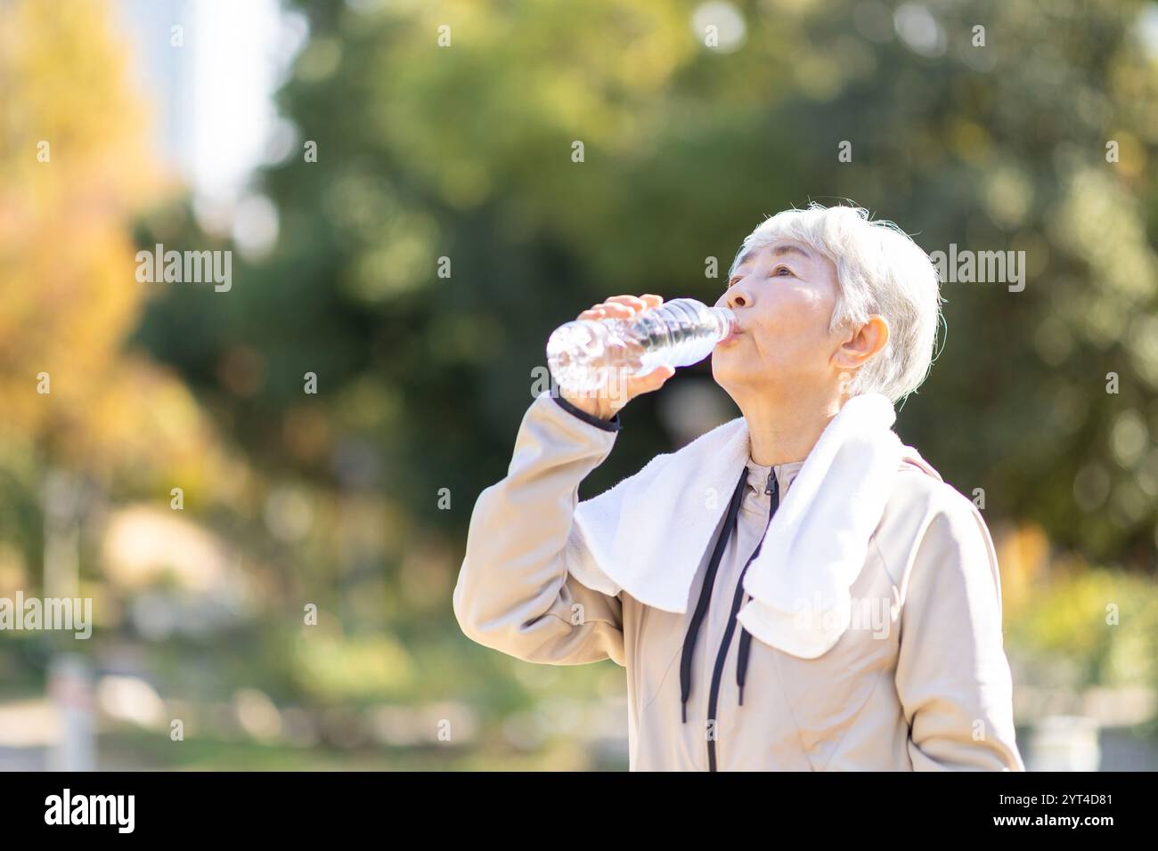 Senior woman drinking water Stock Photo - Alamy