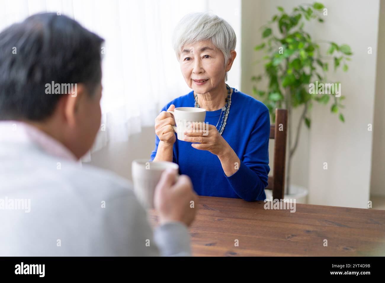Senior woman having conversation hi-res stock photography and images ...