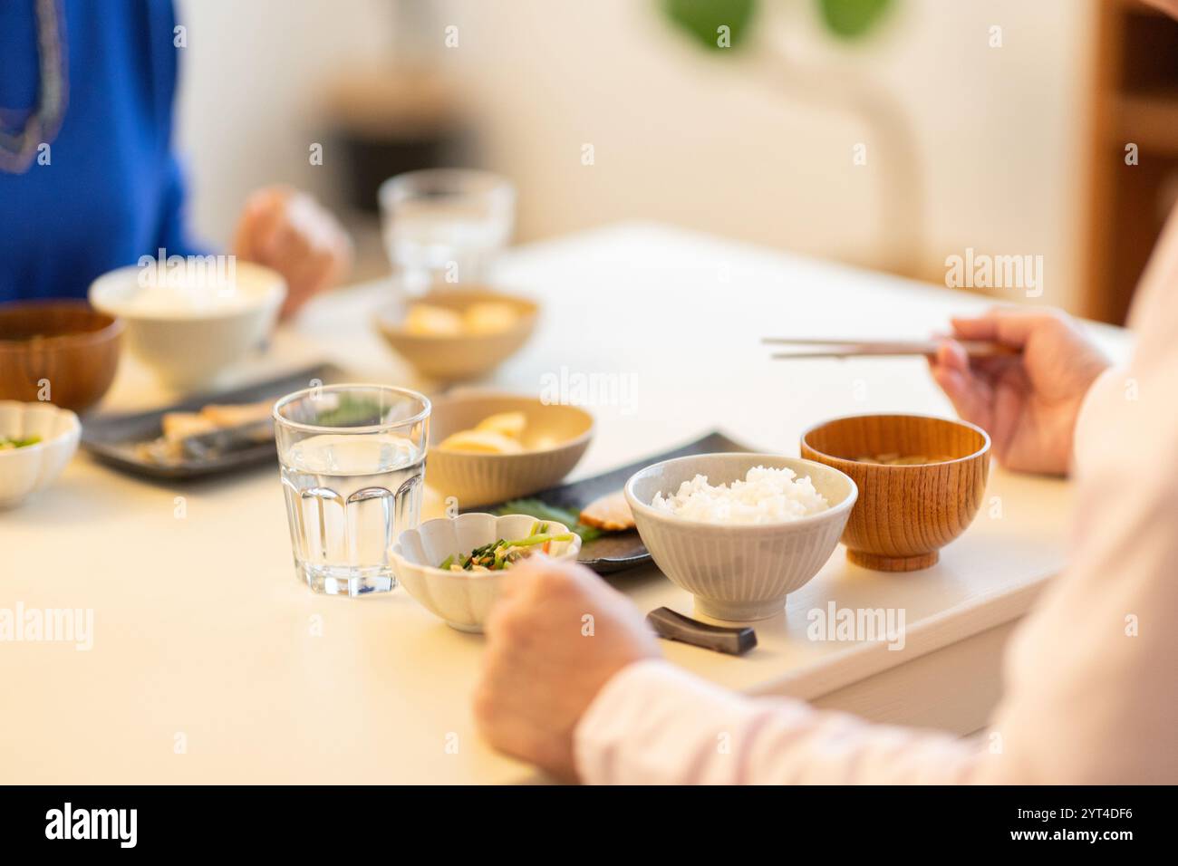 The dining table with dinner lined up Stock Photo - Alamy