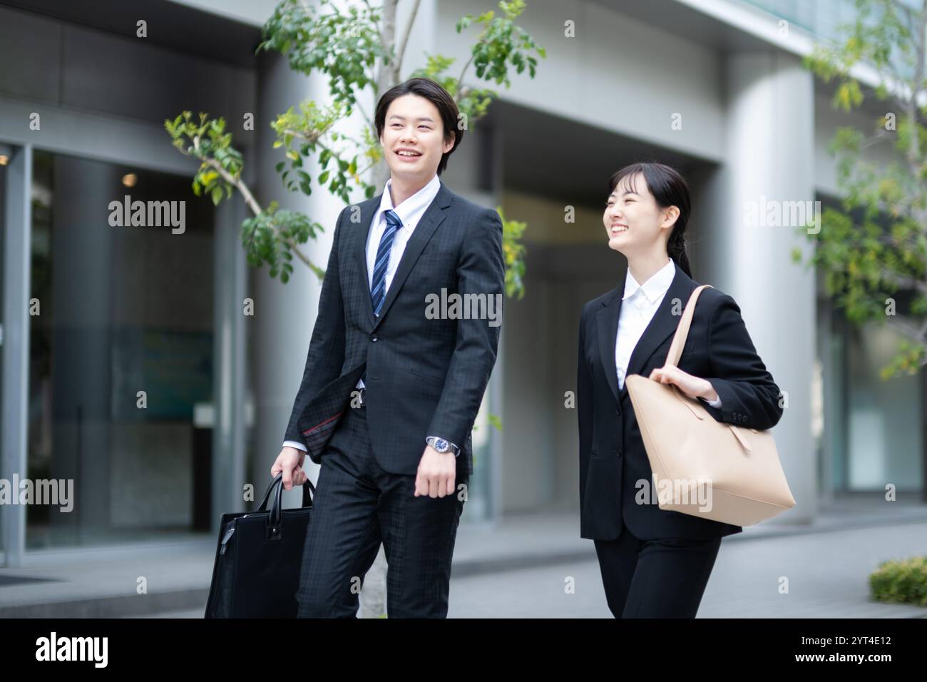 Businessman walking in office building hi-res stock photography and ...