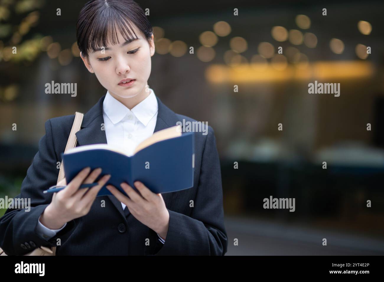Job hunters checking schedules Stock Photo - Alamy