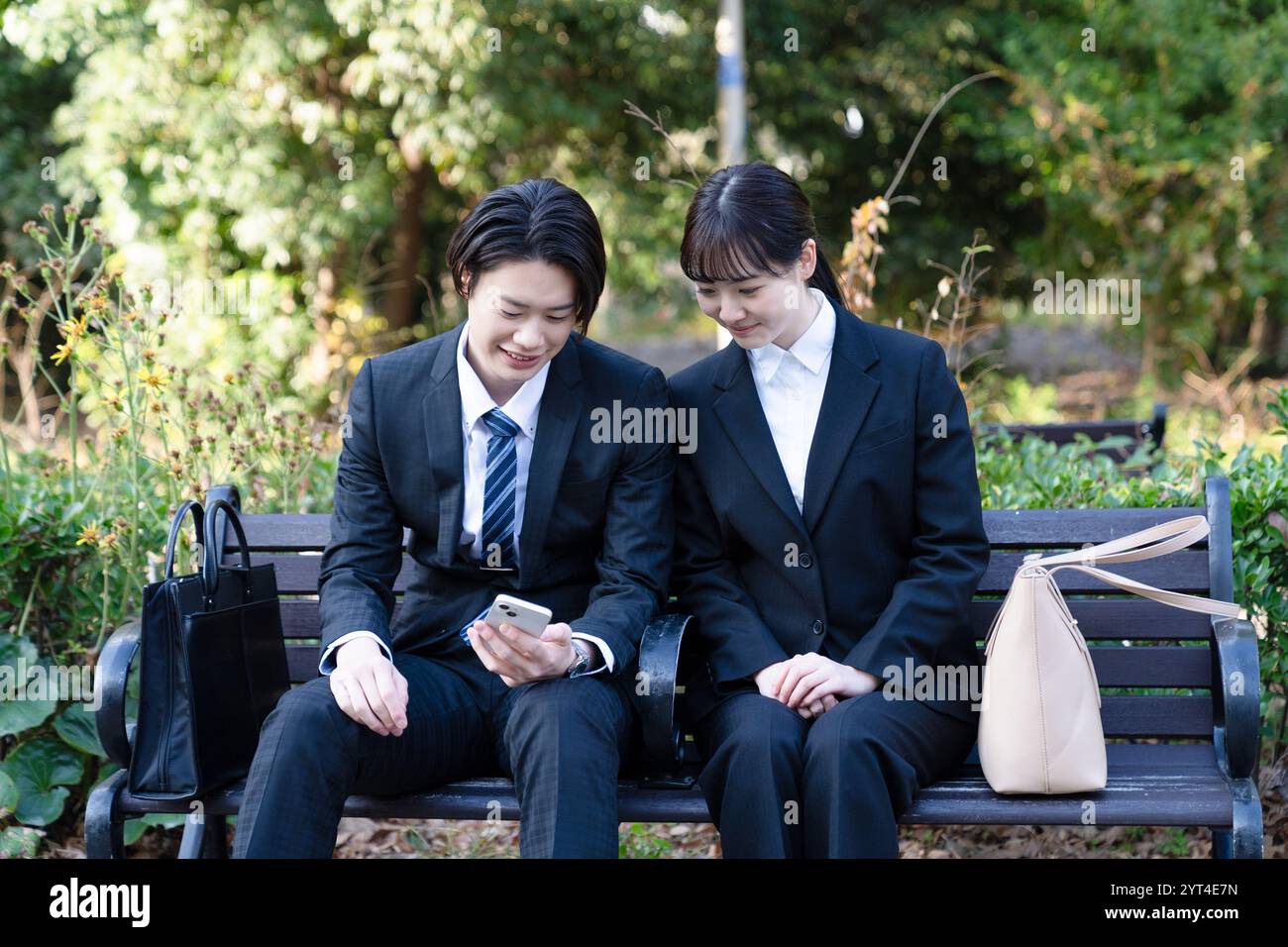 Businessman taking a break sitting on a bench Stock Photo - Alamy
