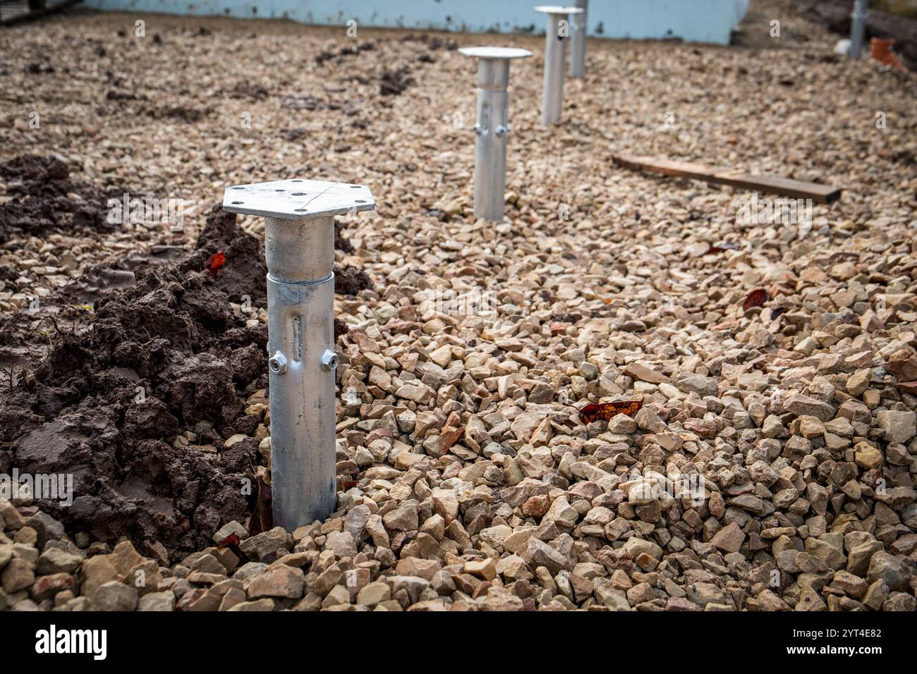 Hot-dip galvanized screw piles screwed into the ground. Abandoned construction Stock Photo - Alamy