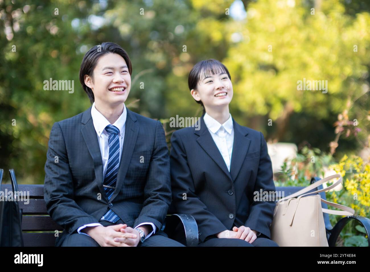 Businessman taking a break sitting on a bench Stock Photo - Alamy