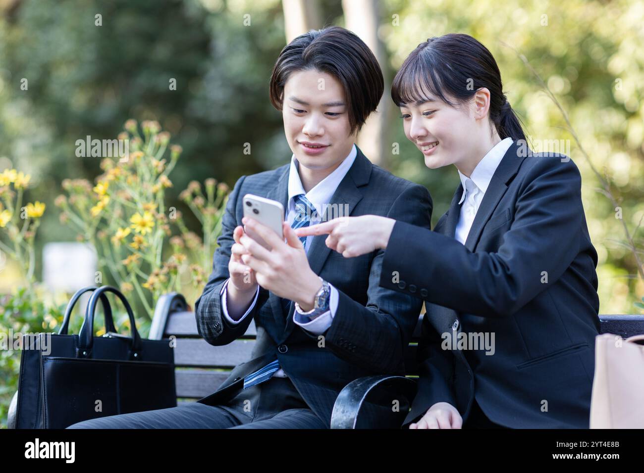 Businessman businesswoman sit on bench hi-res stock photography and ...