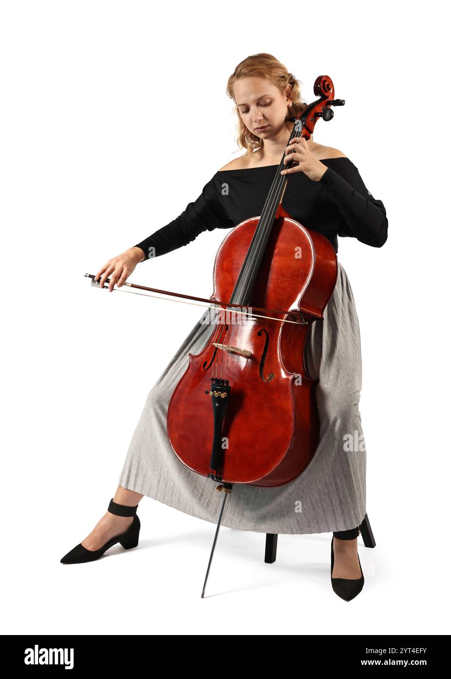 Young beautiful woman playing cello in orchestra Stock Photo - Alamy