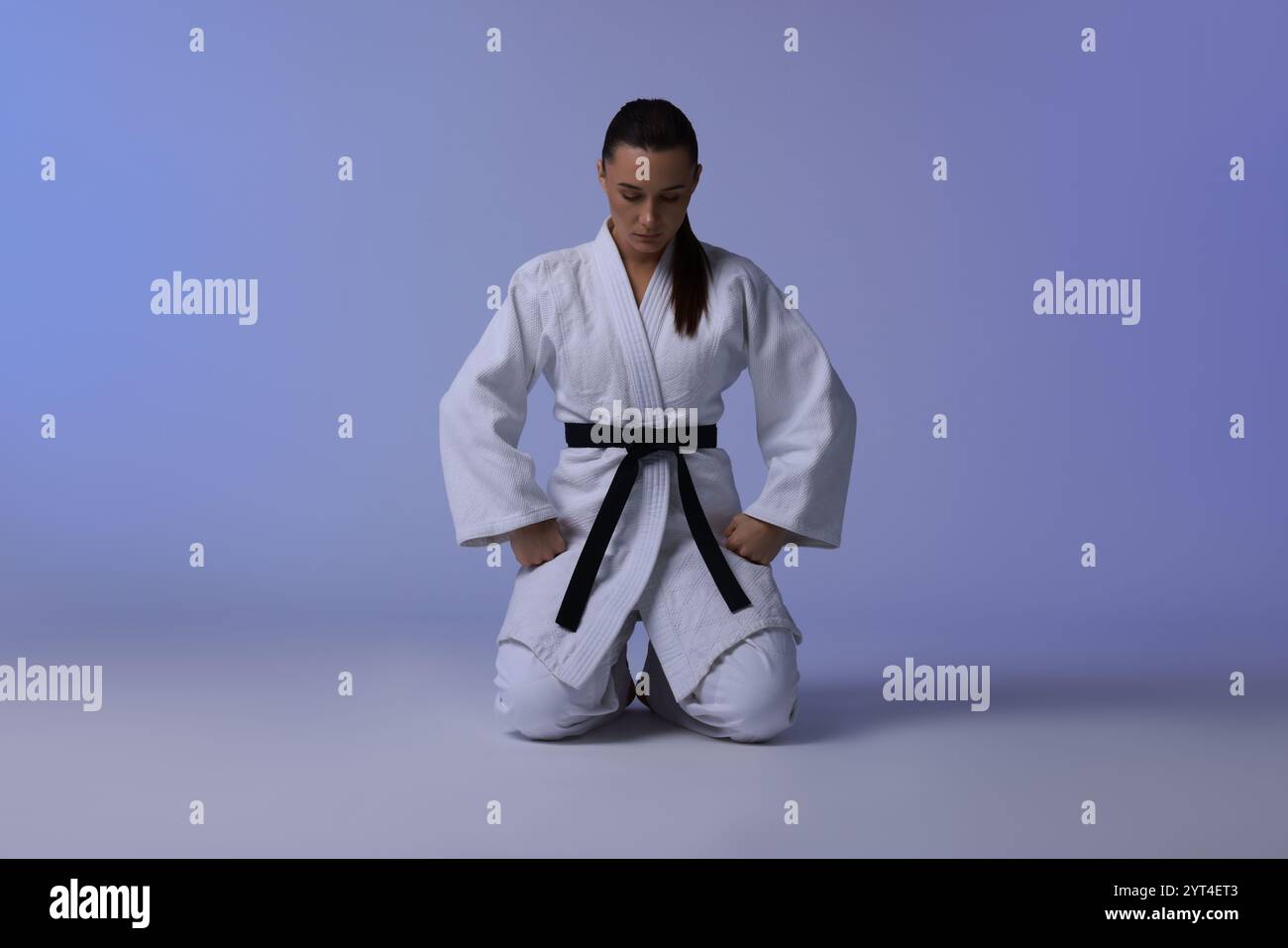 Karate fighter in kimono on light background Stock Photo - Alamy