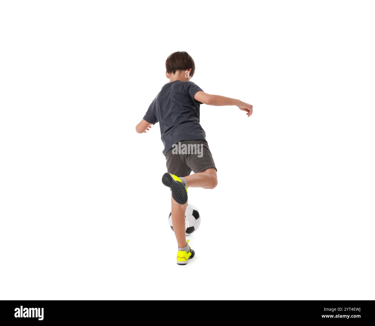 Boy with soccer ball playing football on white background, back view ...