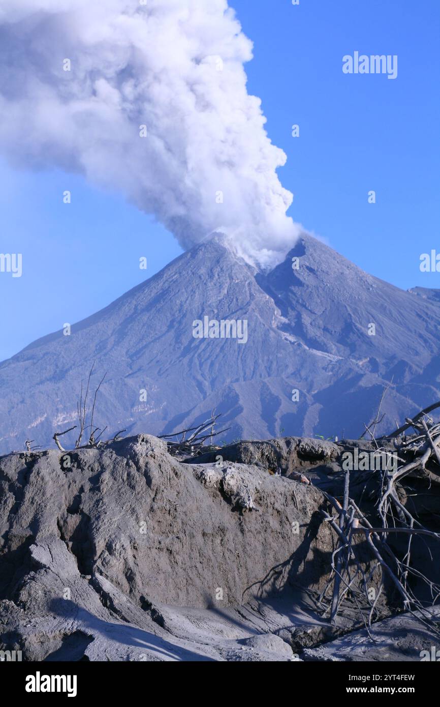 The eruption of Mount Merapi in Yogyakarta, Indonesia. Blue sky ...