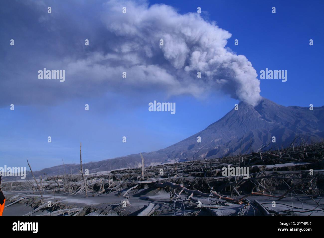 The eruption of Mount Merapi in Yogyakarta, Indonesia. Blue sky ...