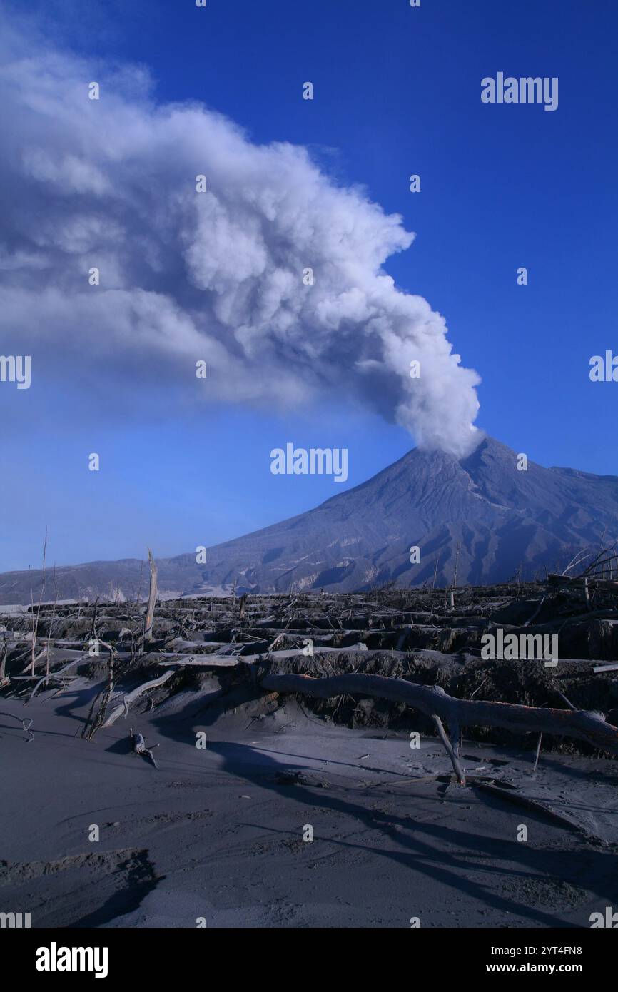 The eruption of Mount Merapi in Yogyakarta, Indonesia. Blue sky ...