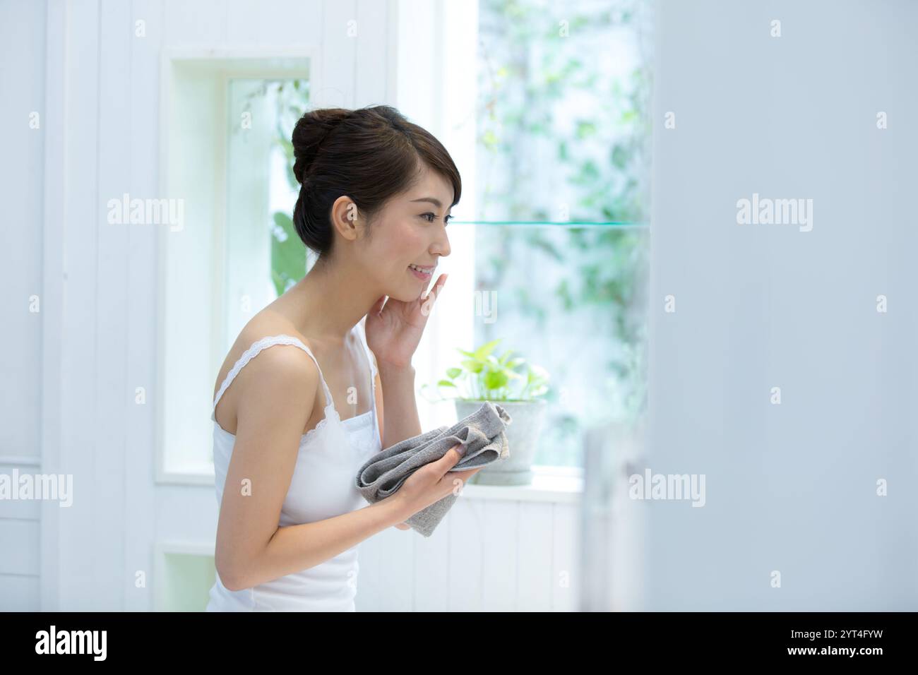 Beautiful woman in washroom Stock Photo - Alamy