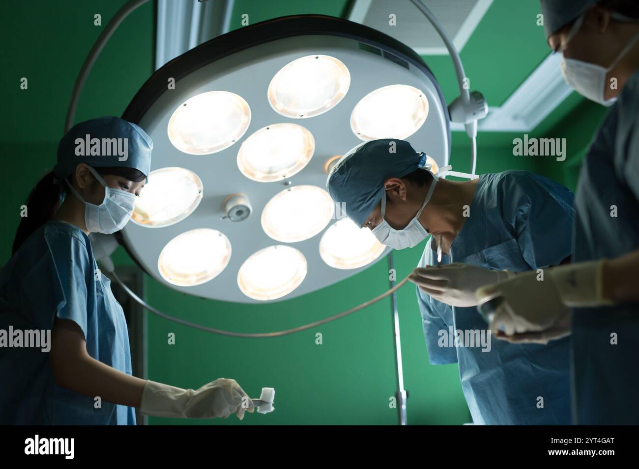Medical staff during surgery Stock Photo - Alamy
