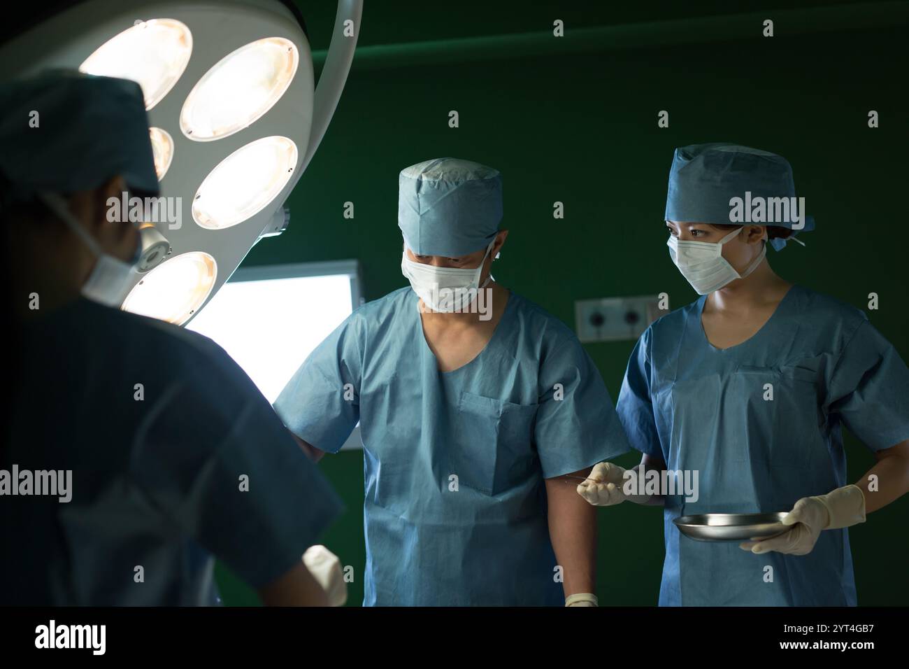 Medical staff during surgery Stock Photo - Alamy