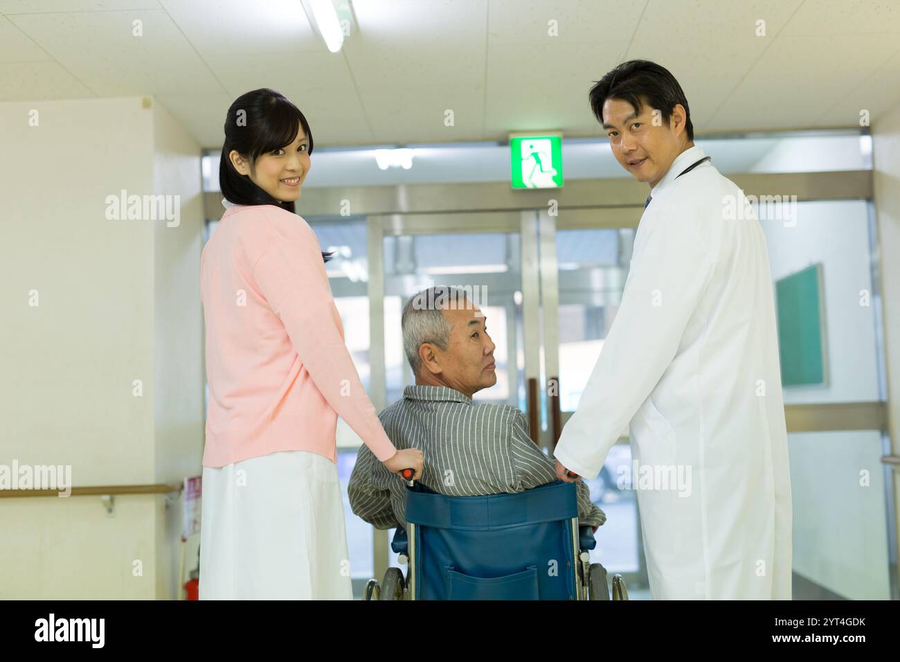 Man and medical staff being discharged from hospital Stock Photo - Alamy