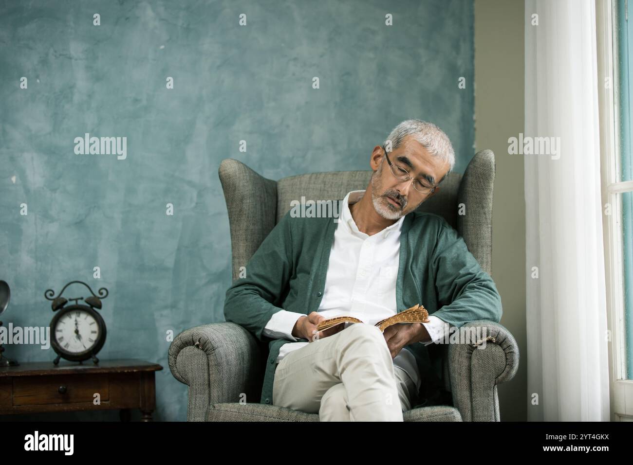 Man sleeping in chair Stock Photo - Alamy