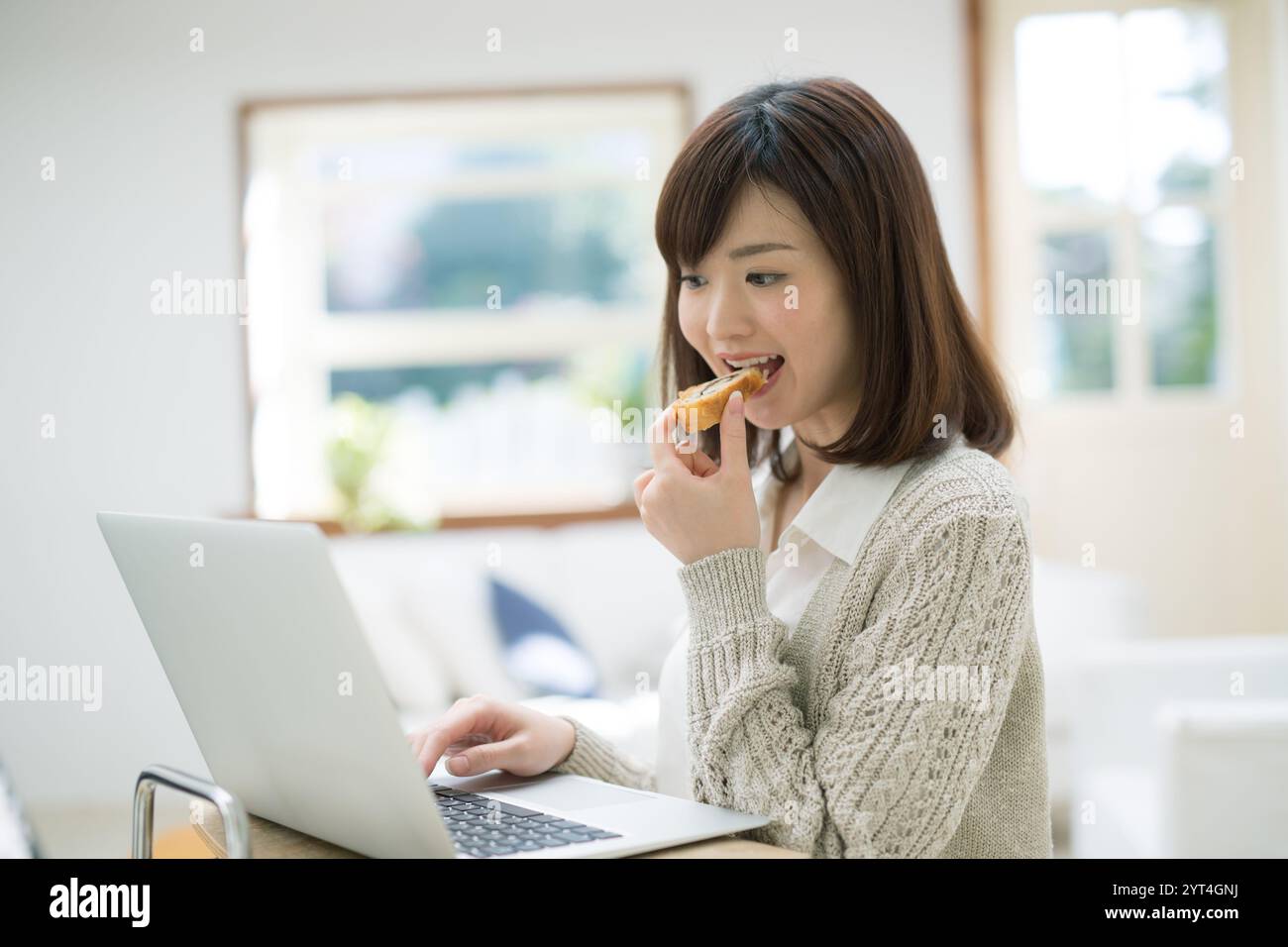 Women using computer in room Stock Photo - Alamy