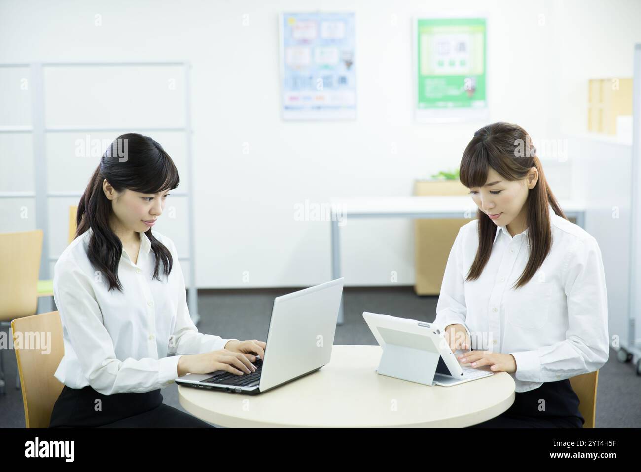Office worker using a computer Stock Photo - Alamy