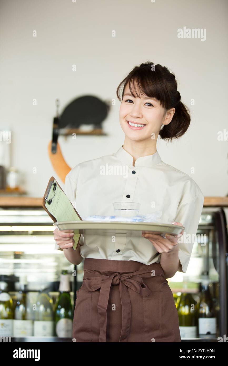 Staff working in a café Stock Photo - Alamy