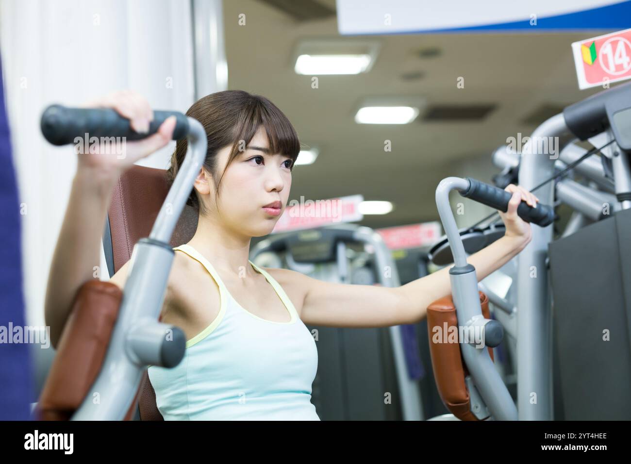 Young woman doing muscle hi-res stock photography and images - Alamy