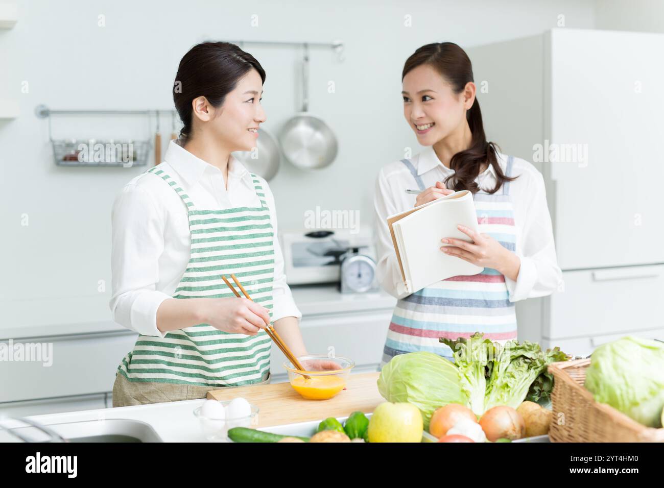 Teacher and student in cooking class Stock Photo - Alamy