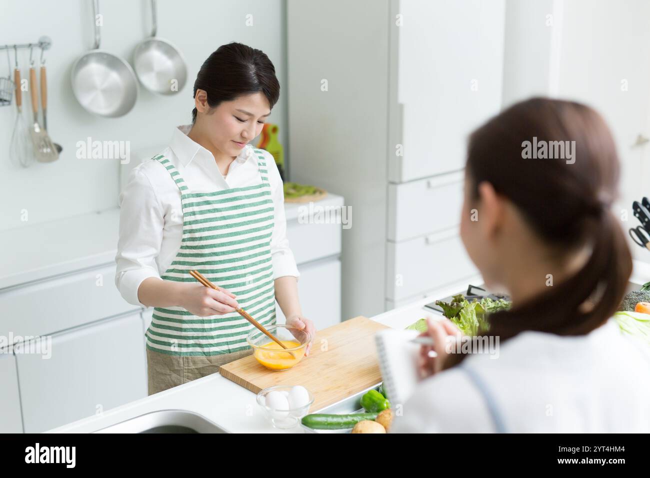 Teacher and student in cooking class Stock Photo - Alamy