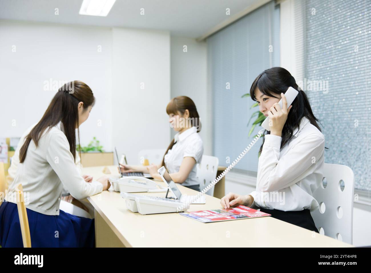 Staff and customers at the counter Stock Photo - Alamy
