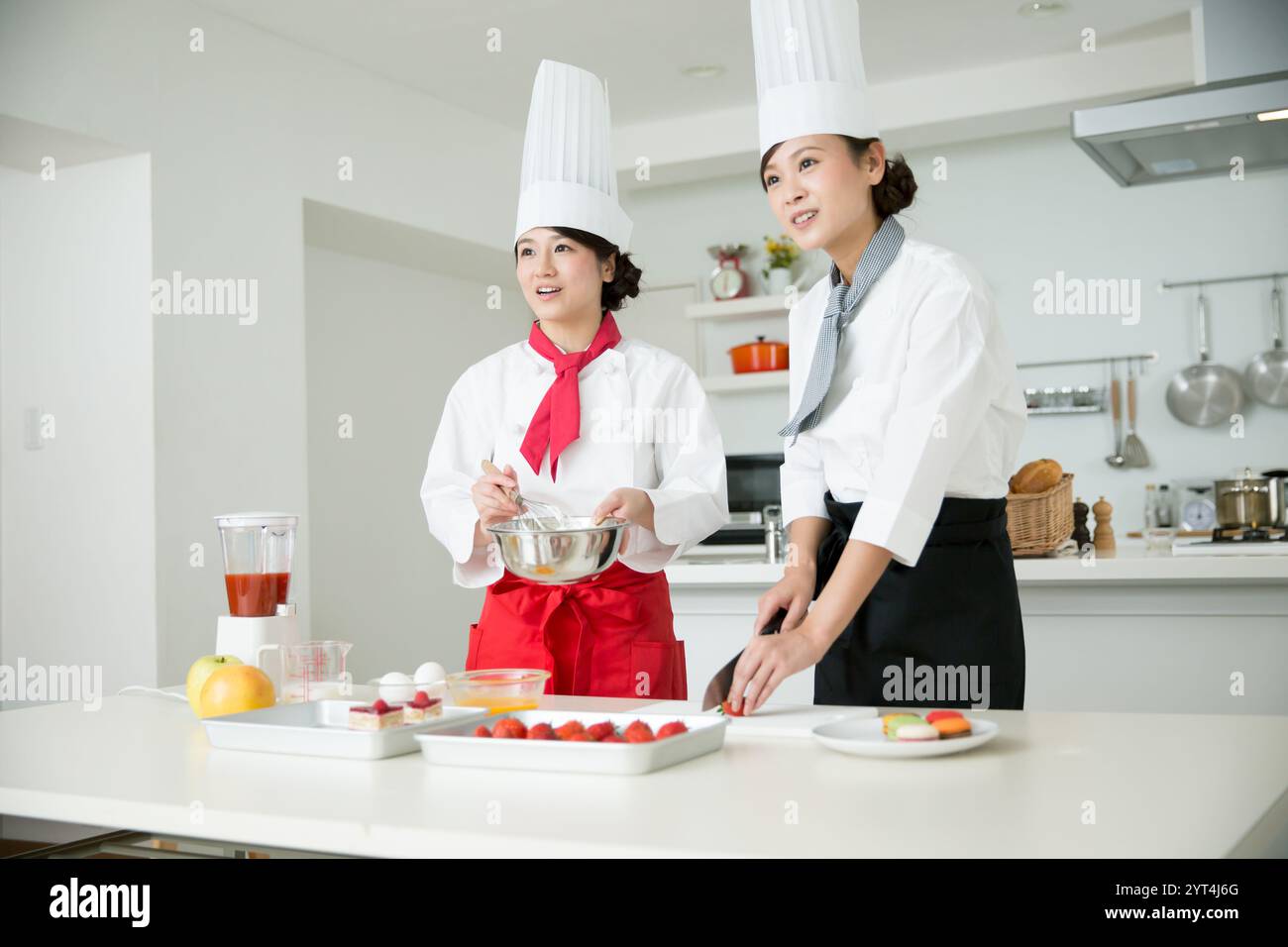 Two patissiers making sweets Stock Photo - Alamy