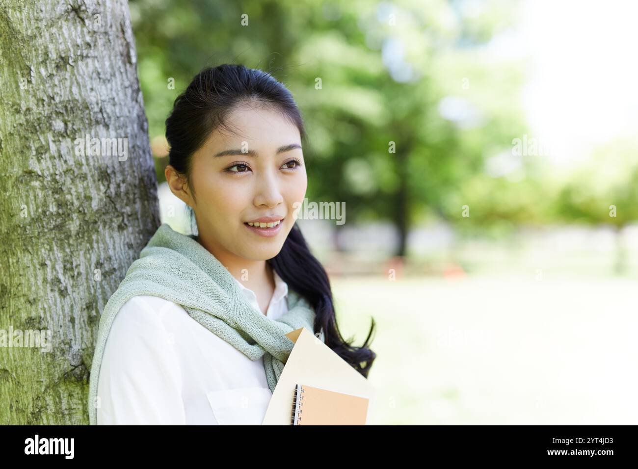 Fresh green and female student Stock Photo - Alamy