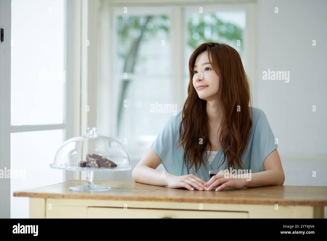 Woman eating sweets hi-res stock photography and images - Alamy