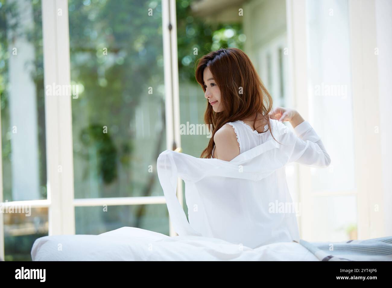 Fresh woman getting dressed in the morning Stock Photo - Alamy
