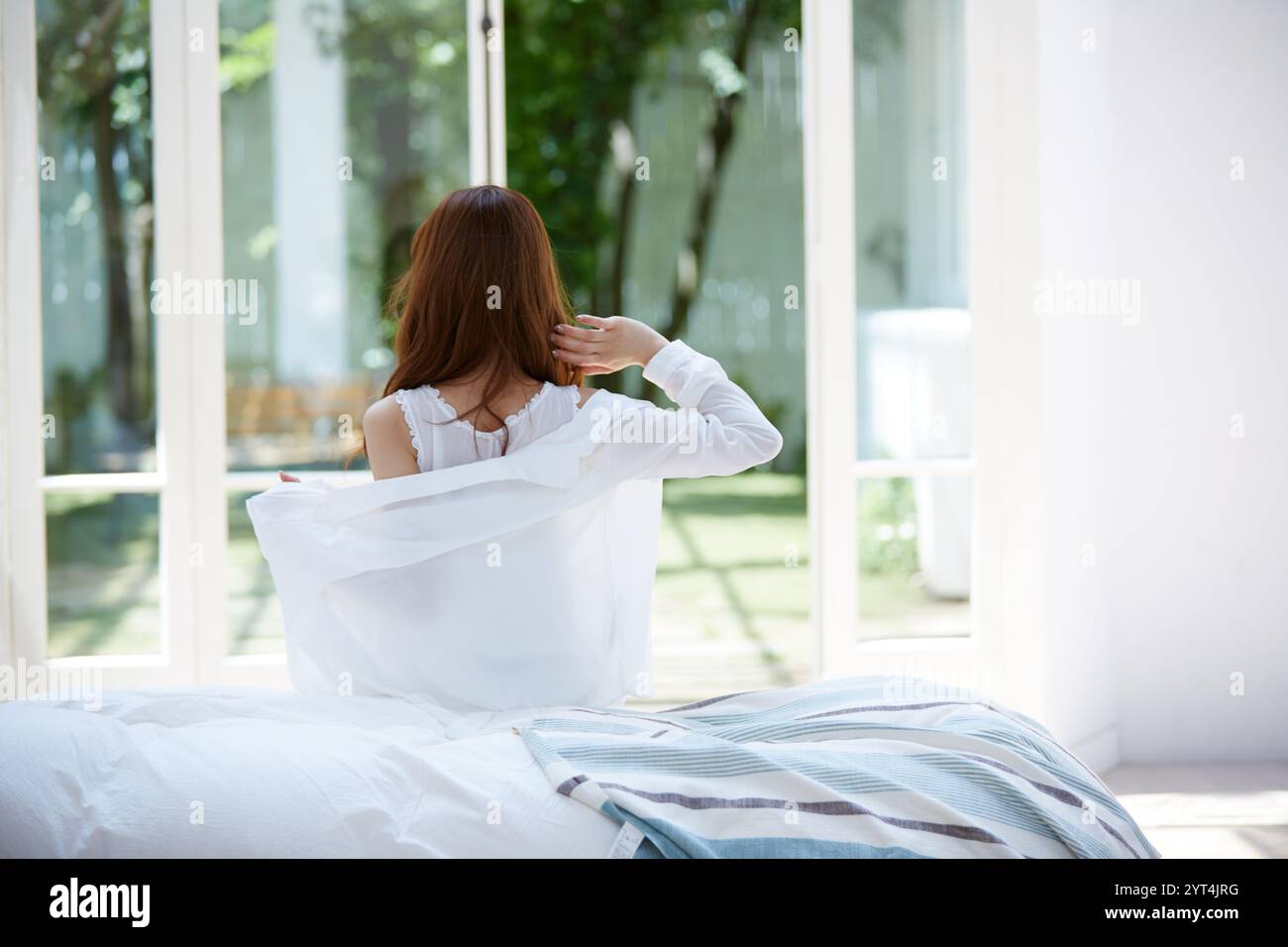Woman getting dressed in bedroom hi-res stock photography and images ...