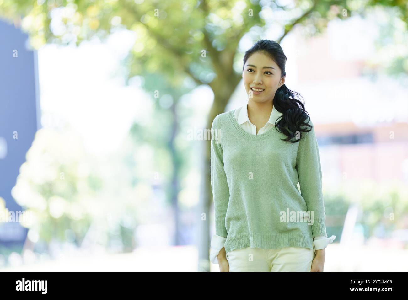Fresh green and young woman Stock Photo - Alamy