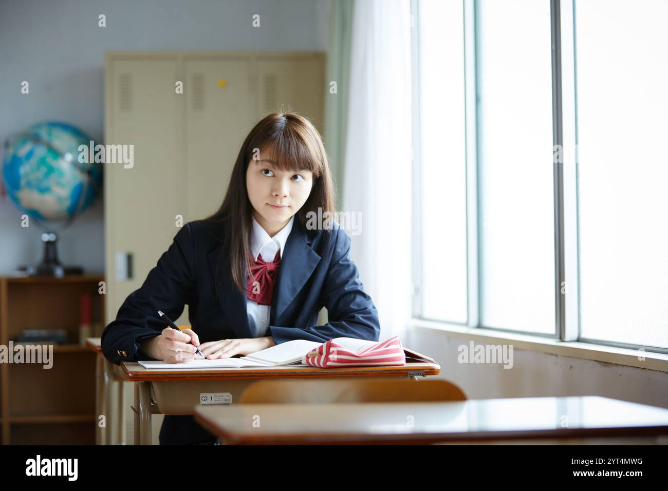 High school girls studying in a classroom Stock Photo - Alamy
