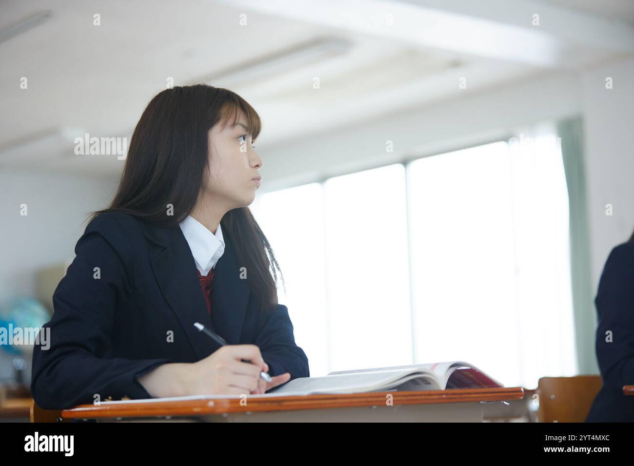 High school girls studying in a classroom Stock Photo - Alamy